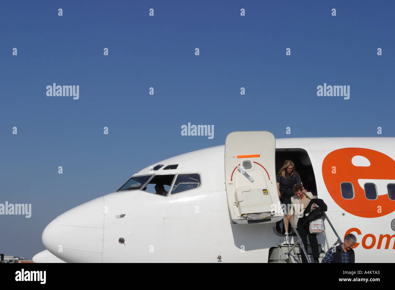 Easyjet low cost airliner with passengers disembarking at Venice Marco ...
