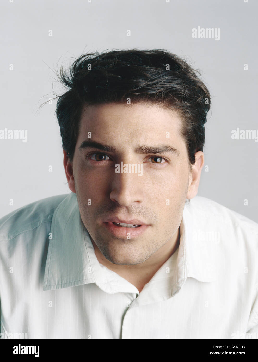 Man leaning toward camera, portrait Stock Photo - Alamy