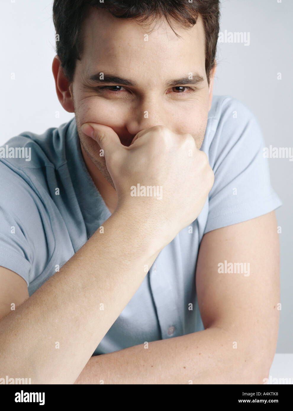 Man hand over mouth laughing hi-res stock photography and images - Alamy