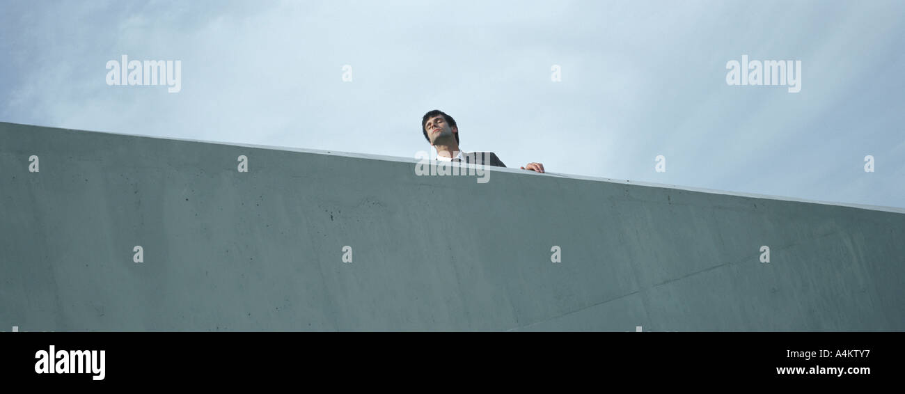 Man behind concrete wall hi-res stock photography and images - Alamy