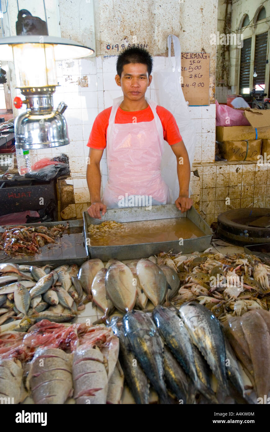 Fish vendor in the wet fish market in Kuching Sarawak Stock Photo - Alamy