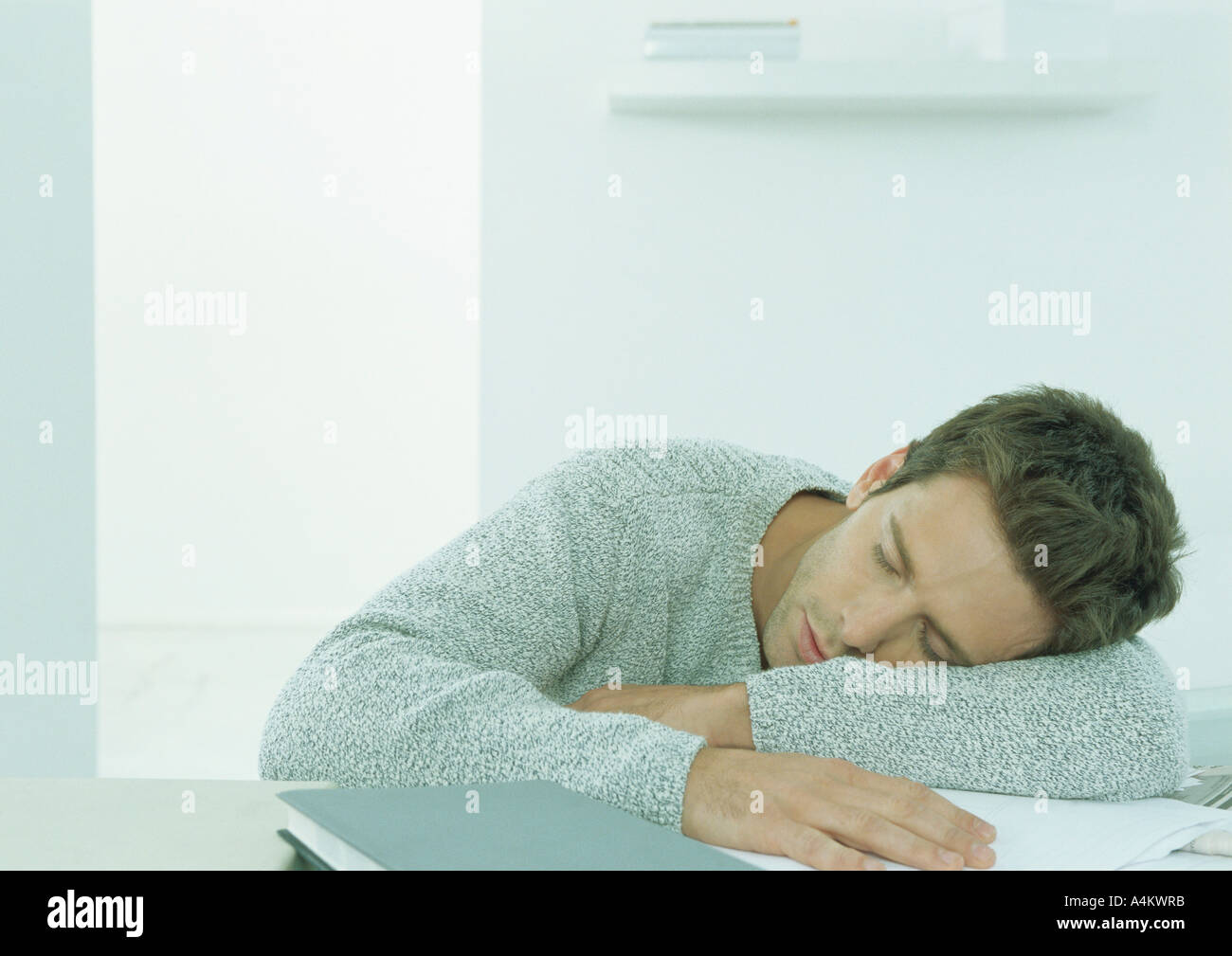 Man sleeping at table Stock Photo - Alamy