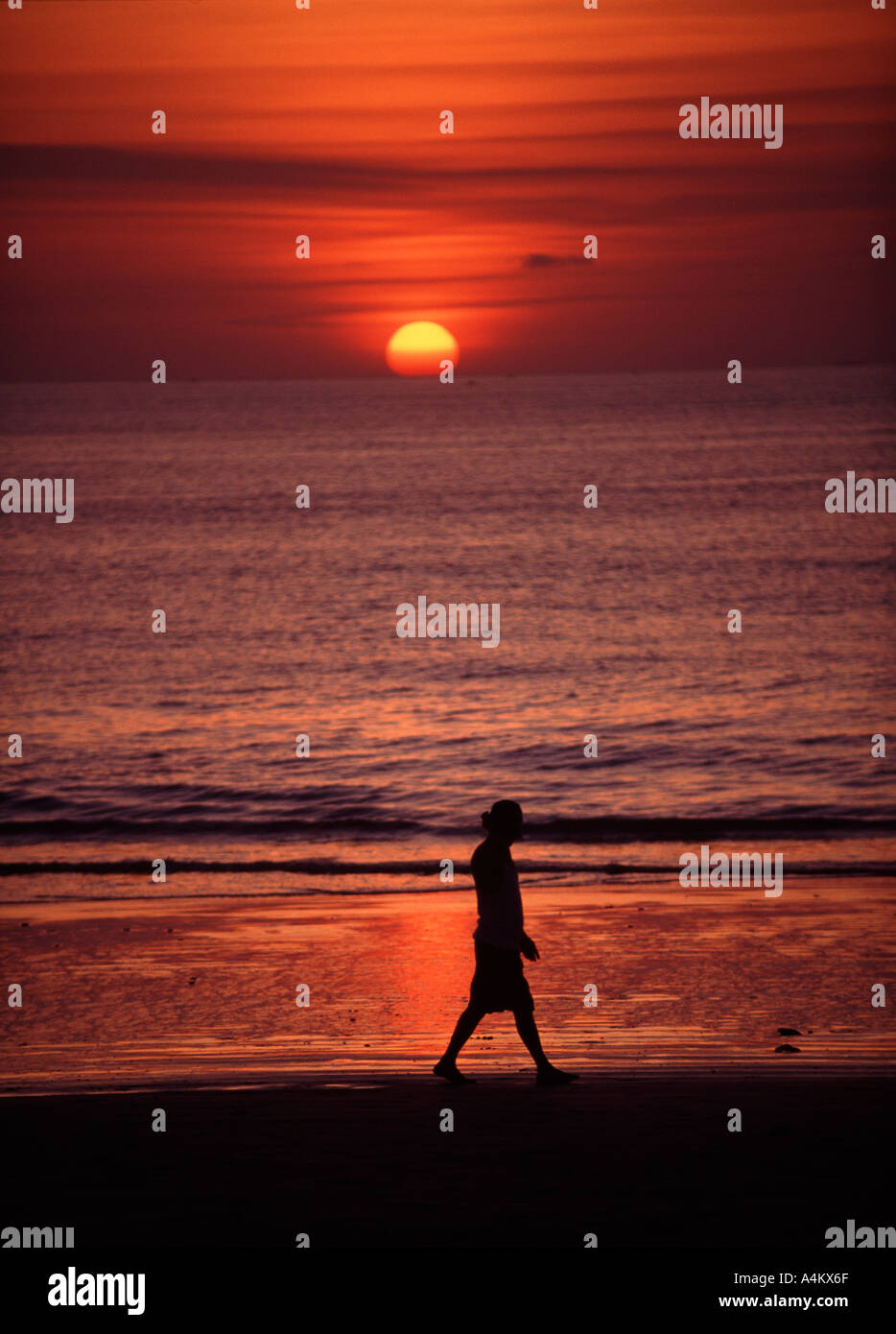 Sunset on beach at Jimbaran Bay Bali Indonesia Stock Photo - Alamy