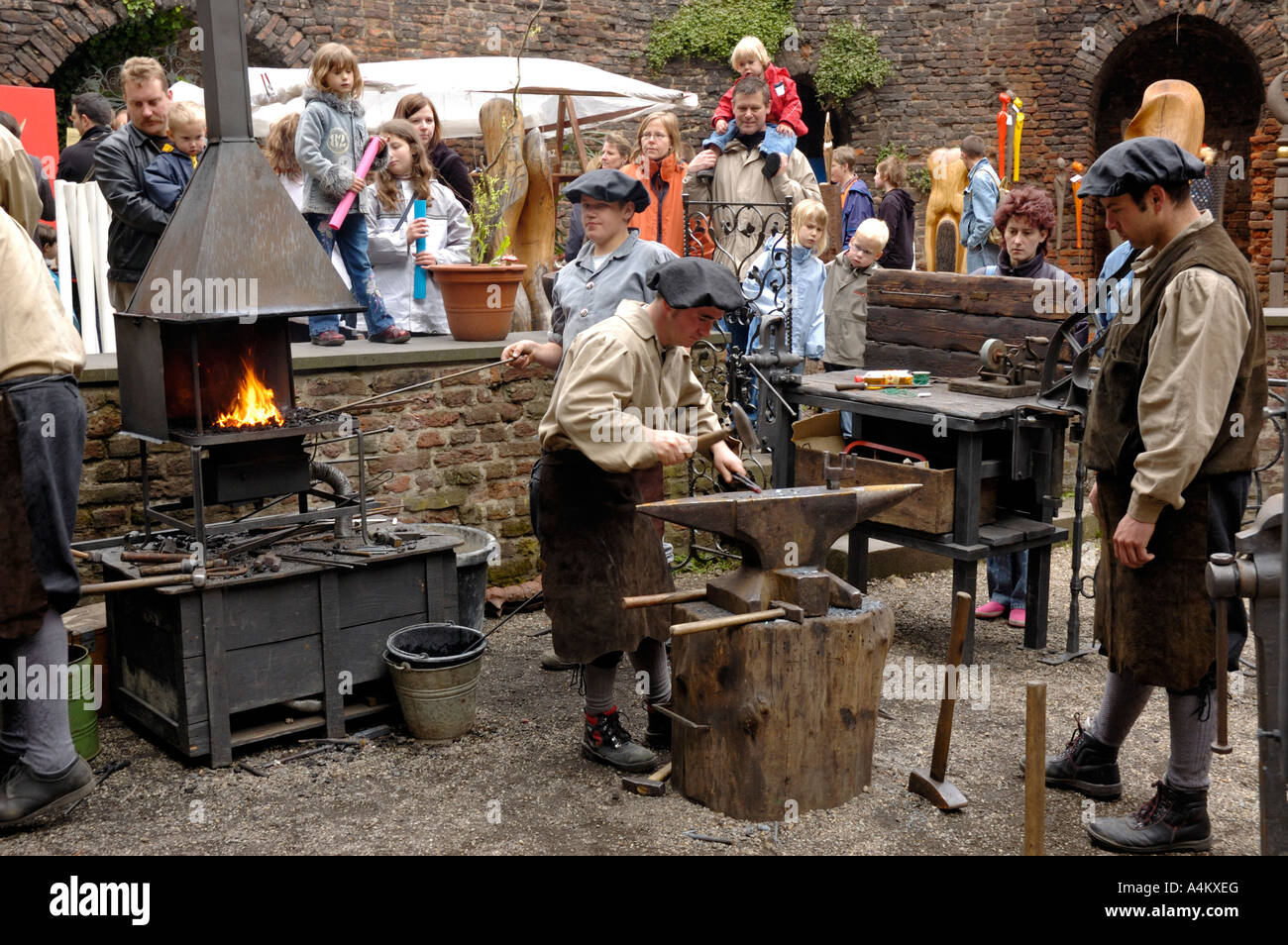 Krefeld, Germany. Flachsmarkt at Burg Linn, 2006. Blacksmith demonstration Stock Photo - Alamy