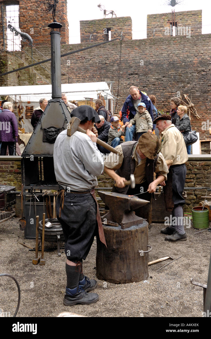 Krefeld, Germany. Flachsmarkt at Burg Linn, 2006. Blacksmith demonstration Stock Photo - Alamy
