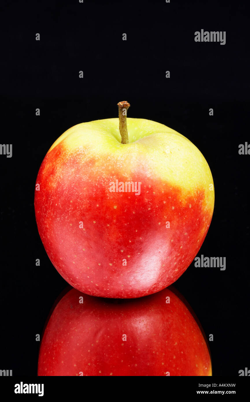 Red apple on black background Stock Photo - Alamy