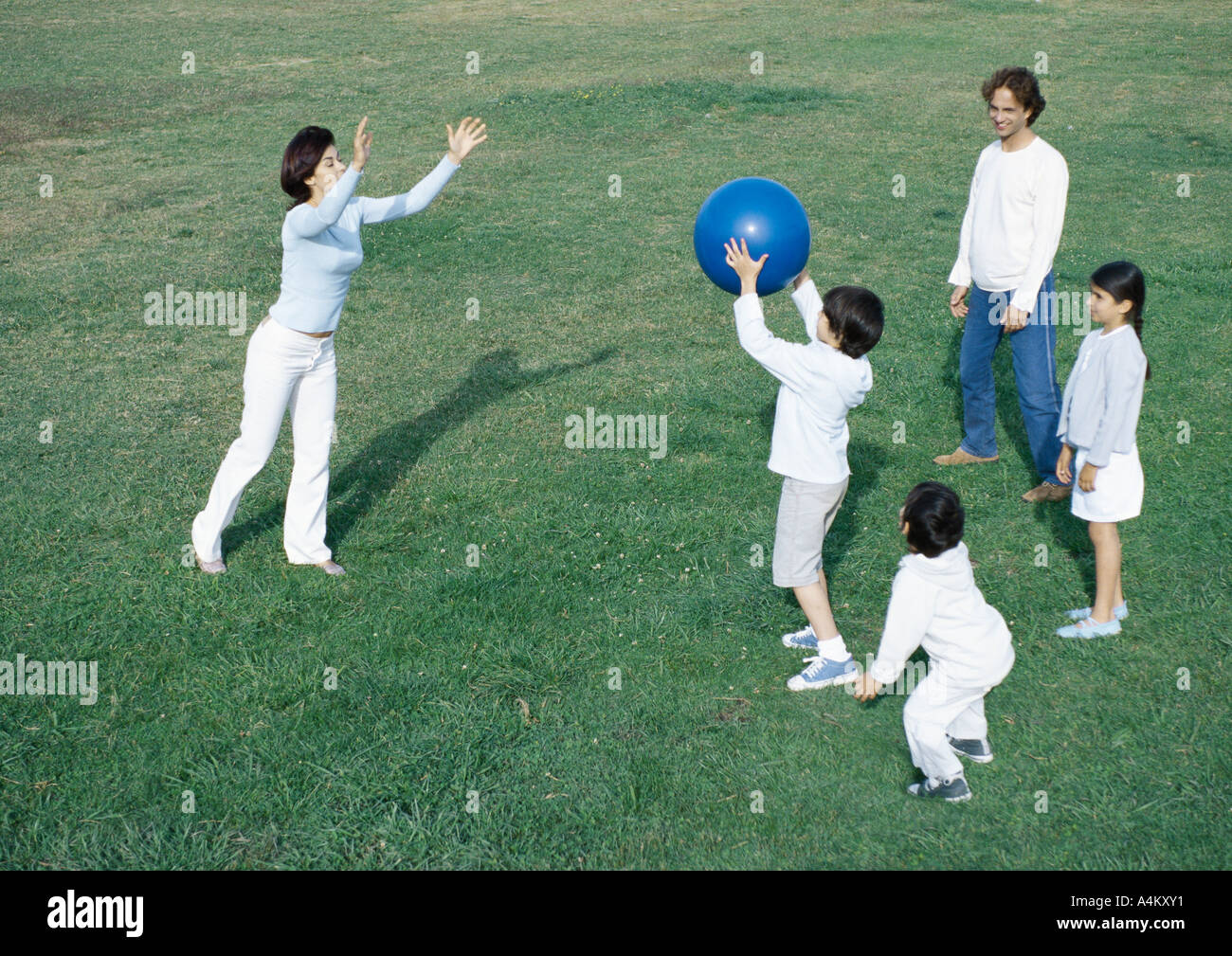 Child catching ball parent hi-res stock photography and images - Alamy