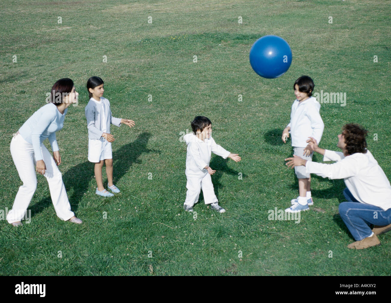Family fun mother father children balls hi-res stock photography and ...