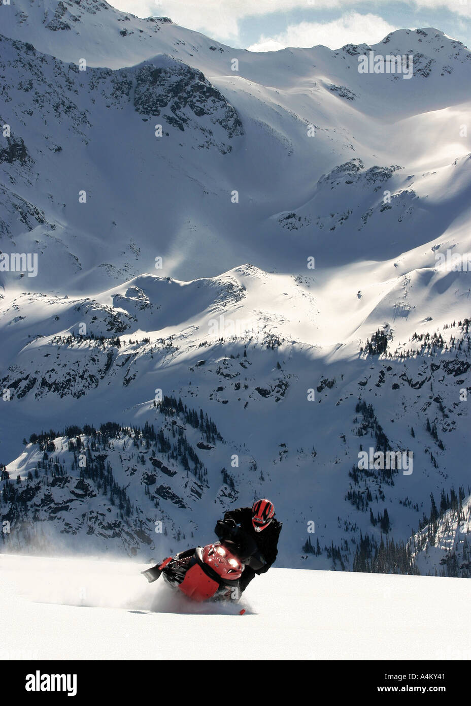 Snowmobile with scenic Mountain background Stock Photo - Alamy