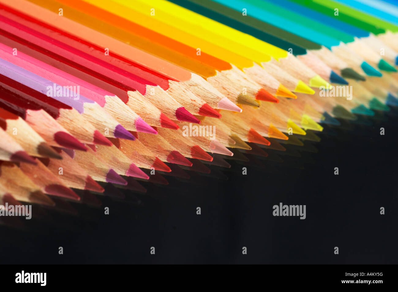 Colored Crayons on a mirror Stock Photo - Alamy