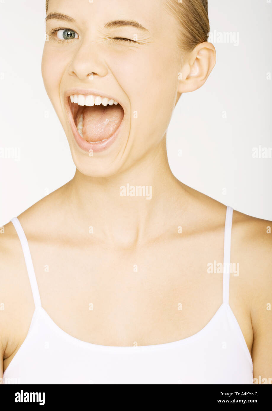 Close up woman winking eye hi-res stock photography and images - Alamy