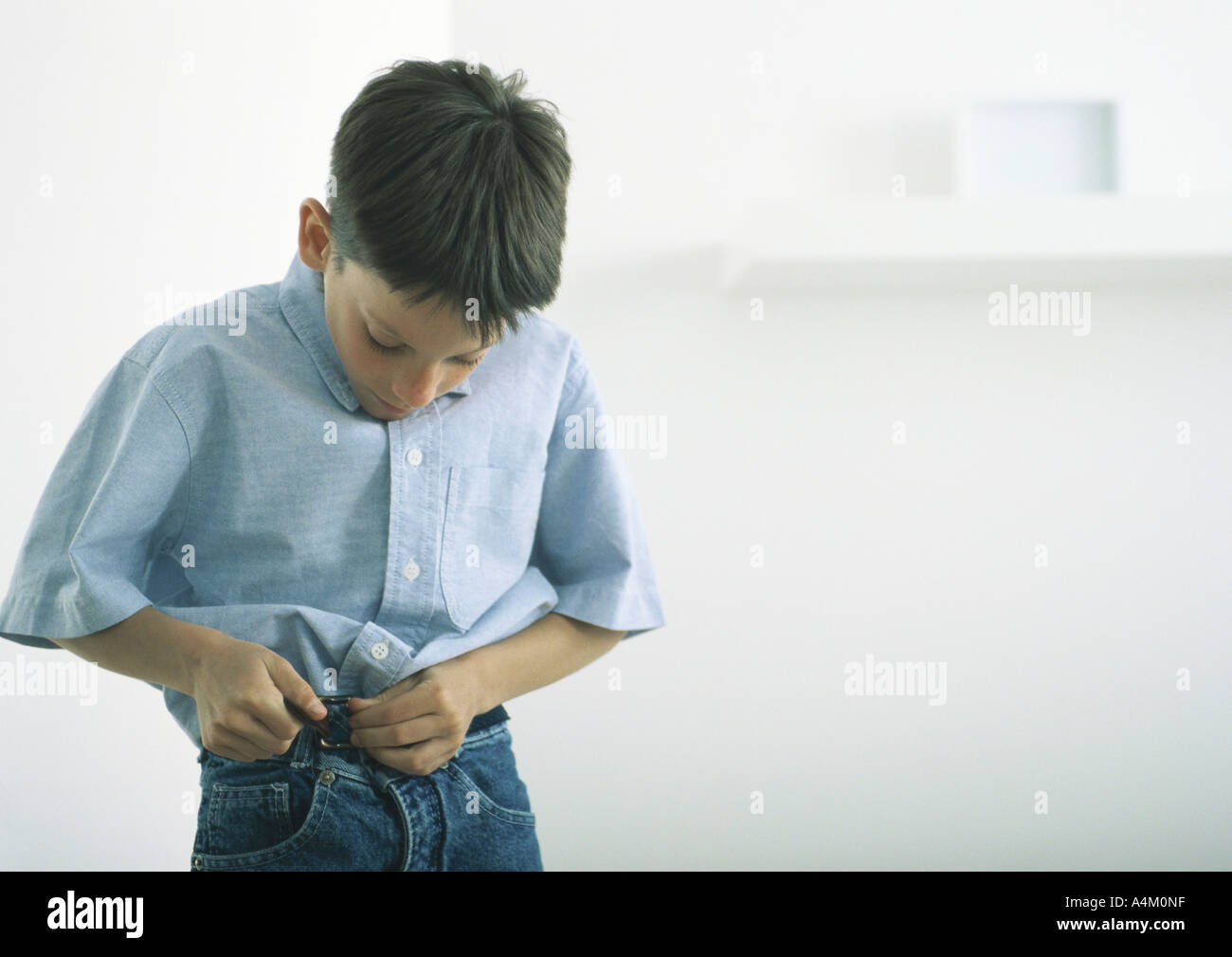 Boy getting dressed morning hi-res stock photography and images - Alamy