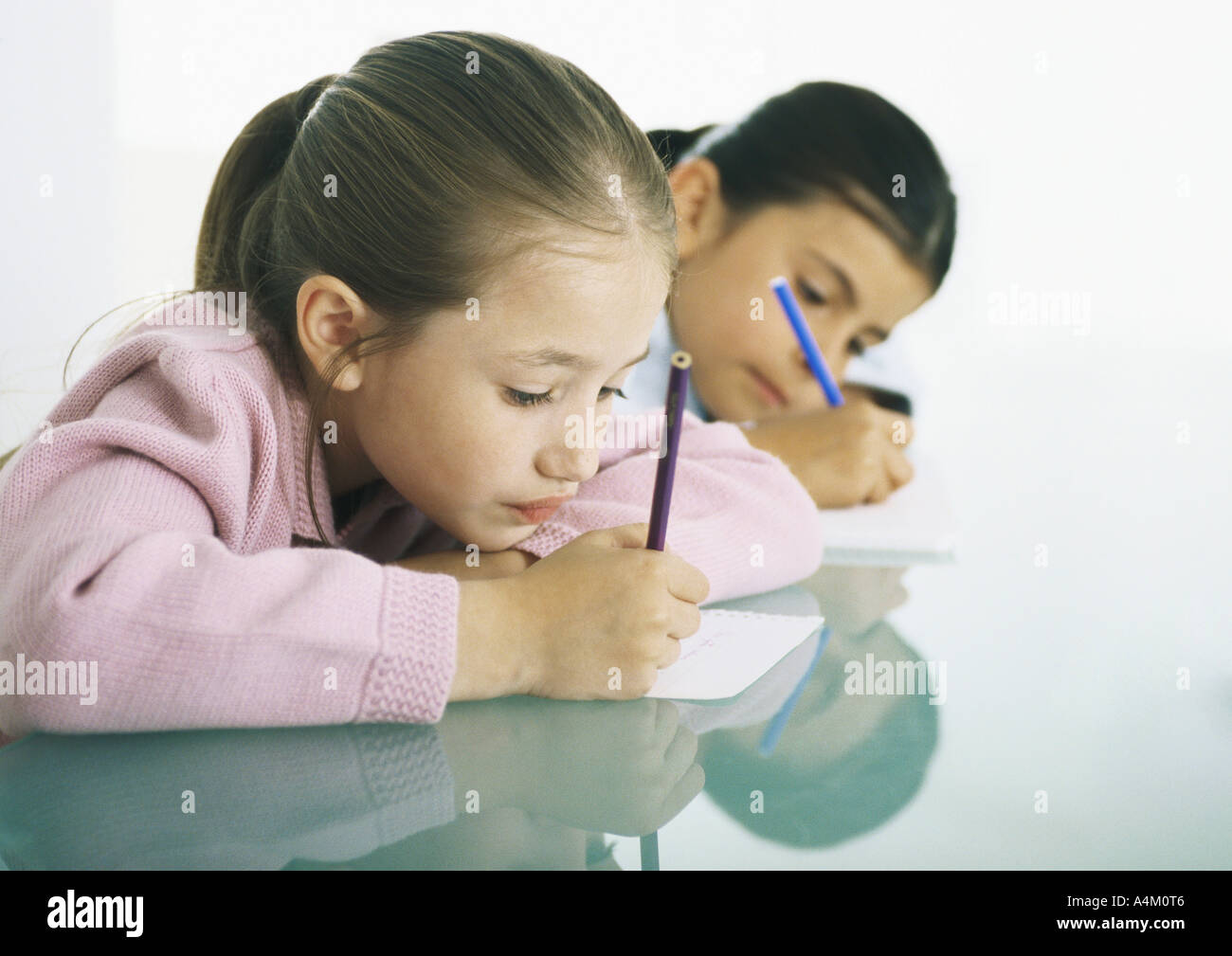 Girl looking down pony tail hi-res stock photography and images - Alamy