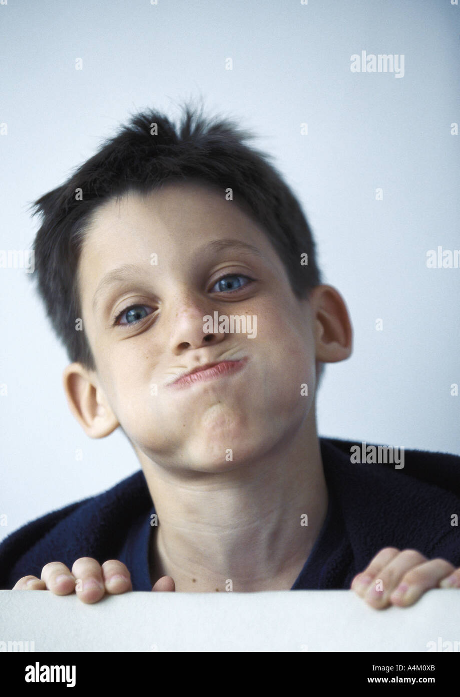 Boy puffing out cheeks, portrait Stock Photo - Alamy