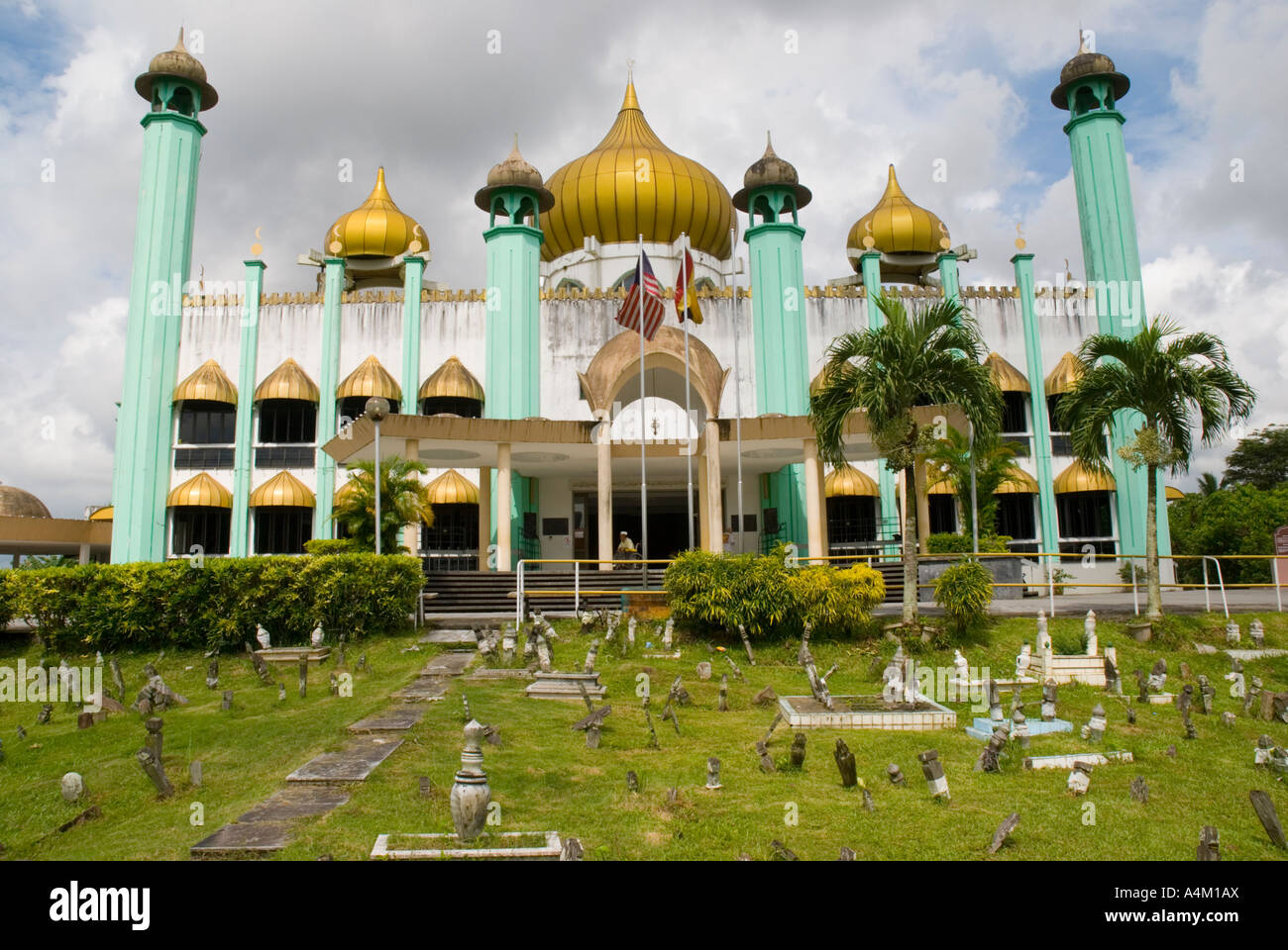 The golden domes and towering minarets of the Kuching Mosque Sarawak ...