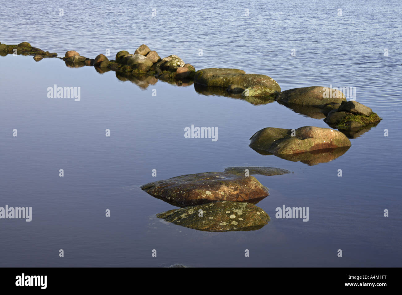 Small stone pier made of natural stones Stock Photo - Alamy