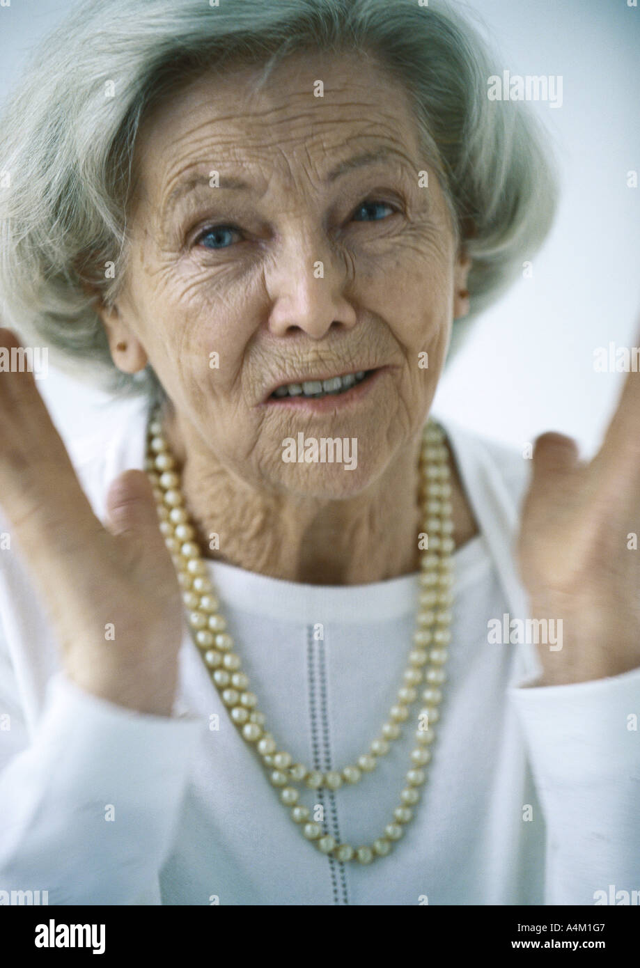 Woman raised hands looks hi-res stock photography and images - Alamy
