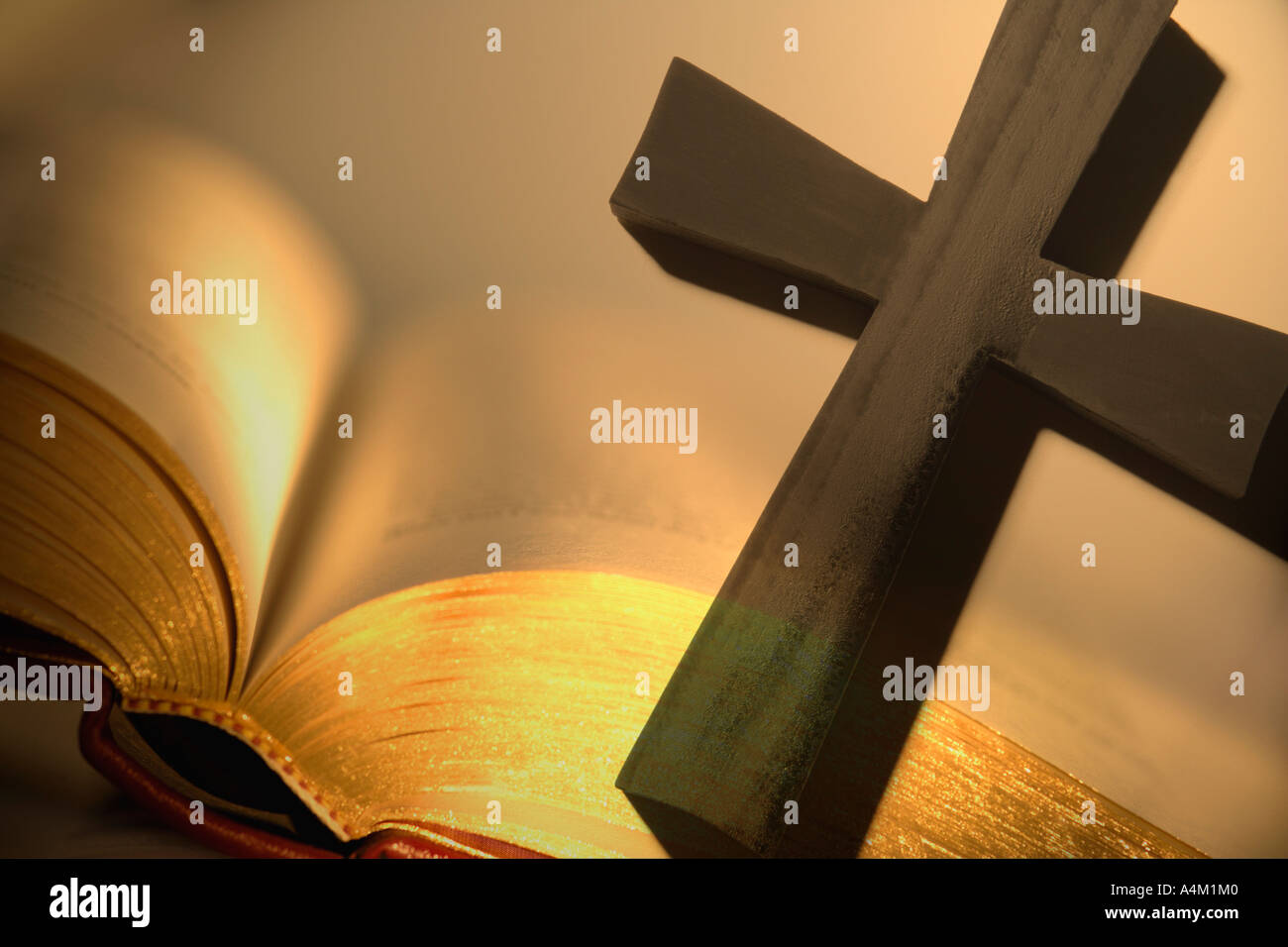 Cross with open bible Stock Photo - Alamy
