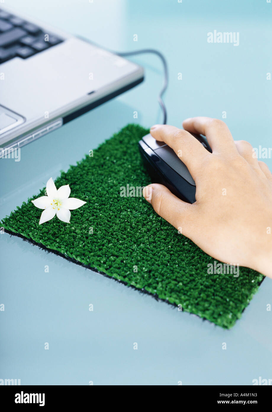Hand using mouse on mouse pad made of artificial turf Stock Photo - Alamy