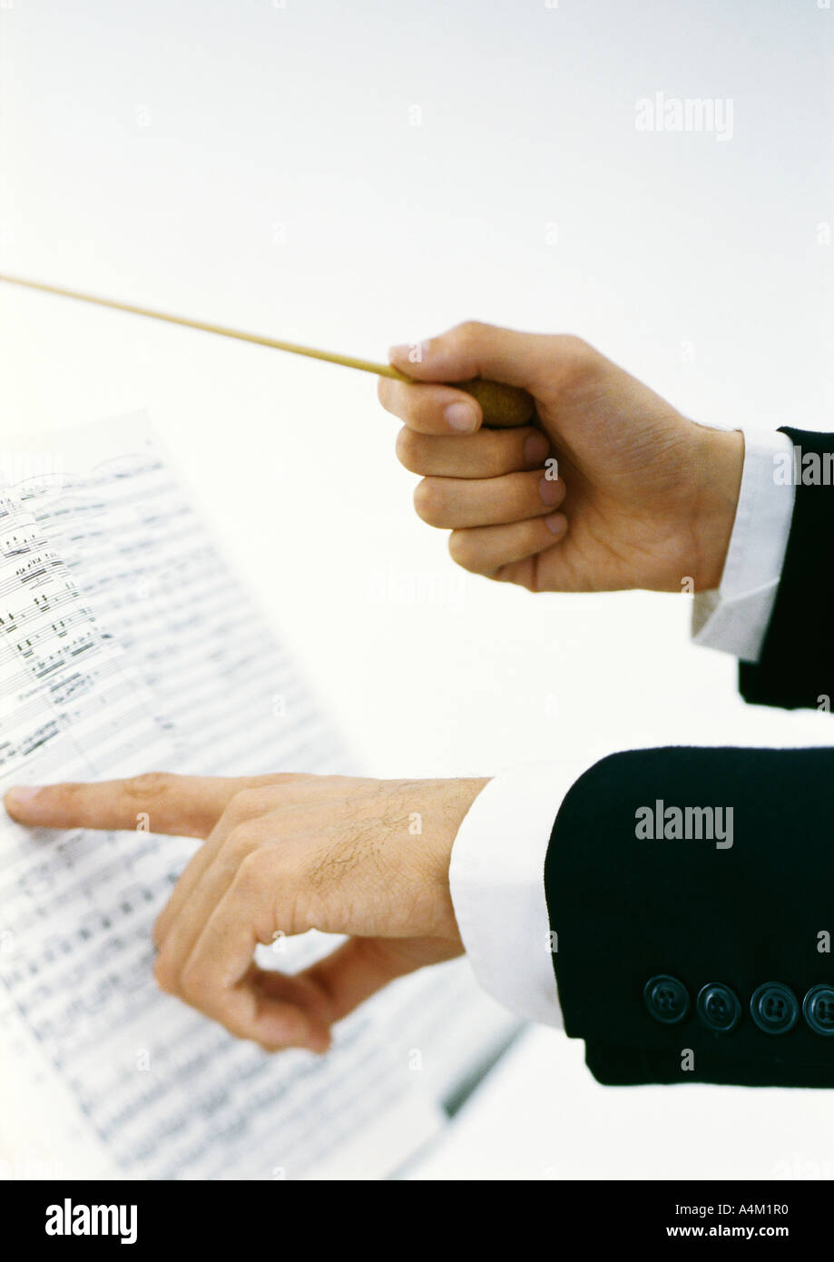 Conductors hands holding baton pointing hi-res stock photography and ...