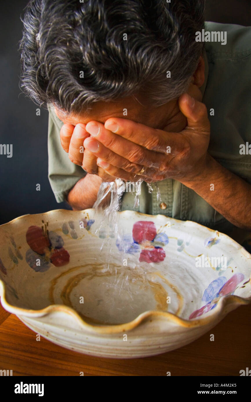Man washes his face Stock Photo - Alamy