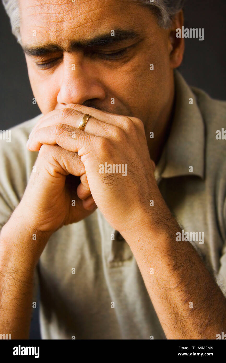Man turns to prayer Stock Photo - Alamy