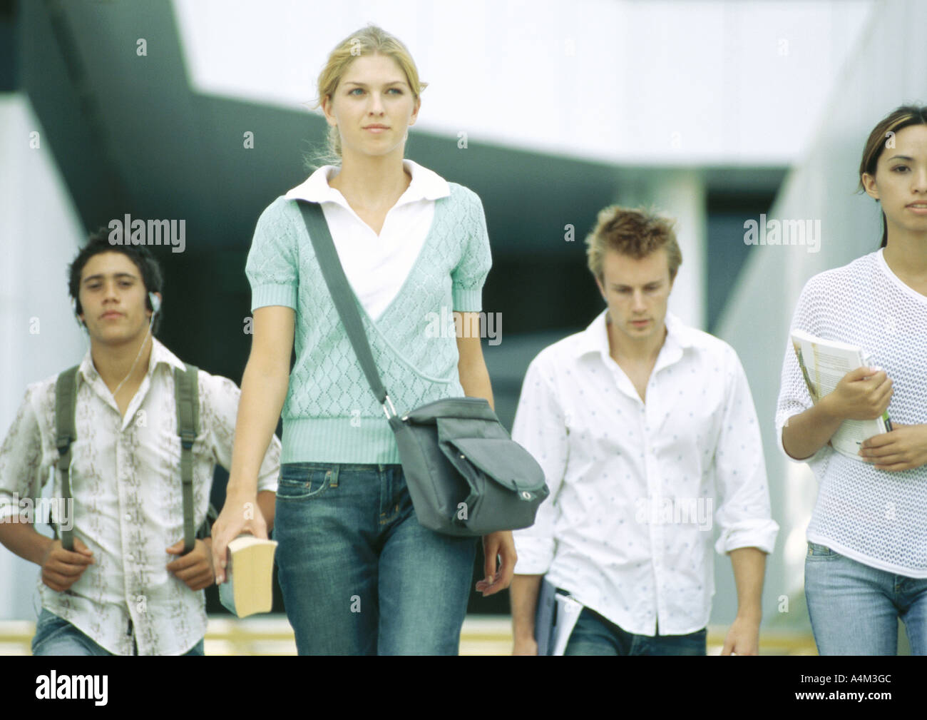 Students walking, front view Stock Photo - Alamy
