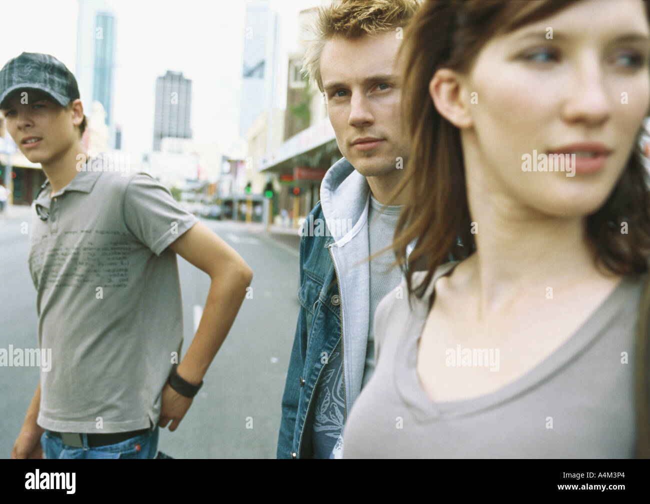 Young people standing in street Stock Photo - Alamy