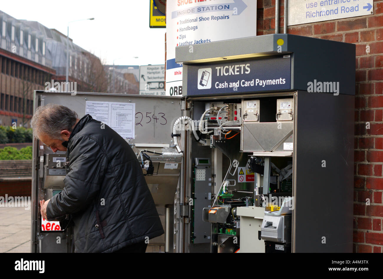 Mending an out of order ticket machine at Kingston train station London ...