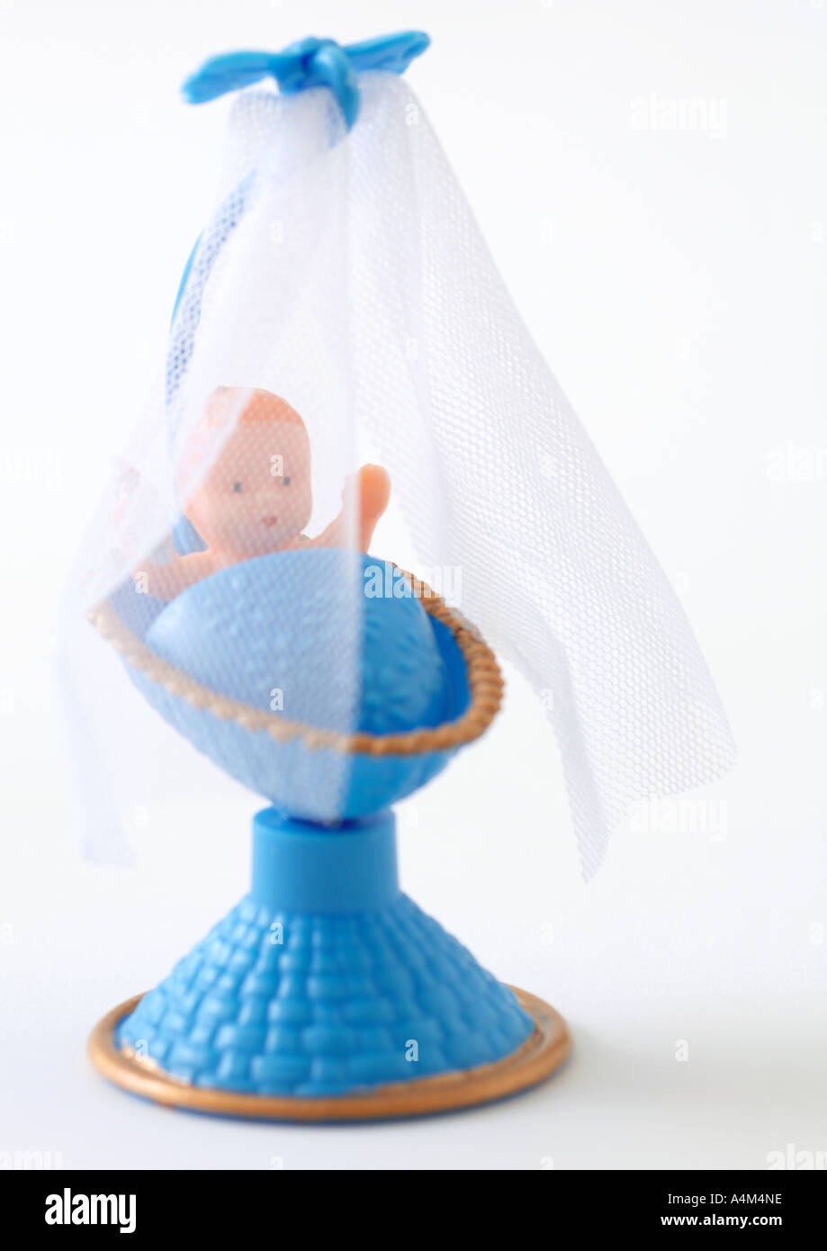 Plastic baby in blue crib Stock Photo - Alamy