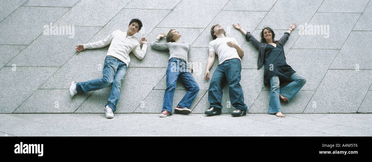Young people striking poses Stock Photo - Alamy