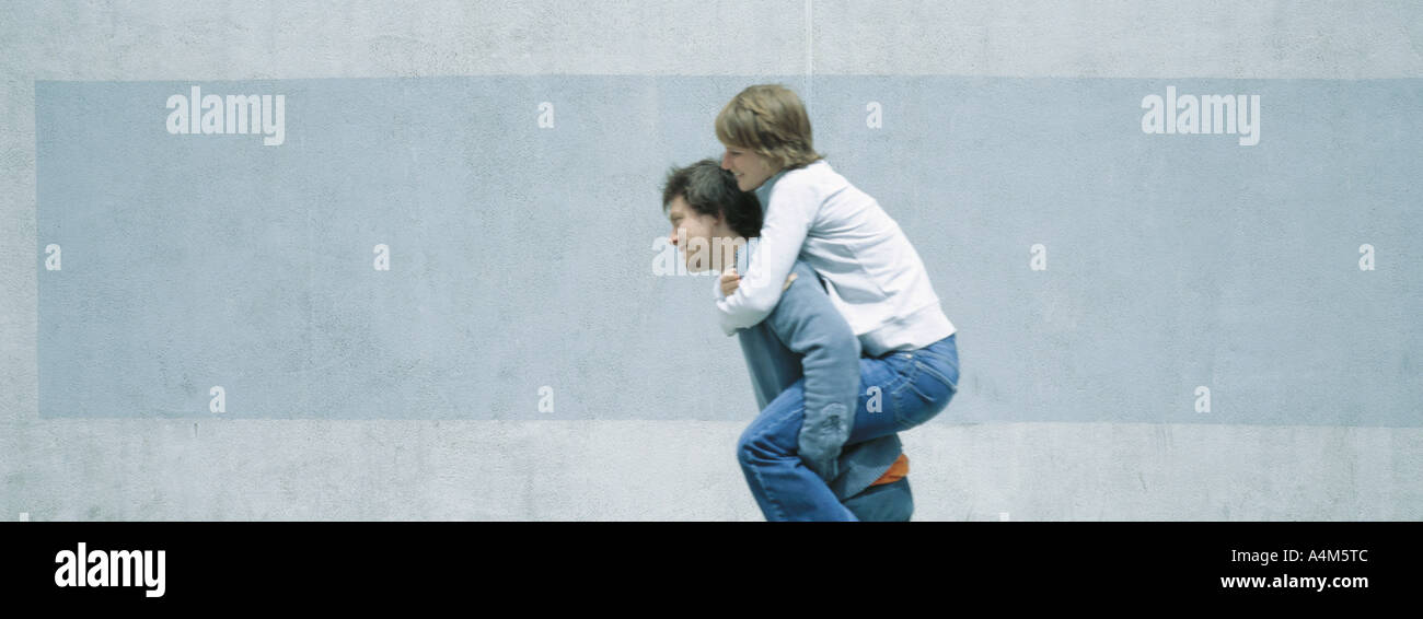 Piggyback adults side view hi-res stock photography and images - Alamy