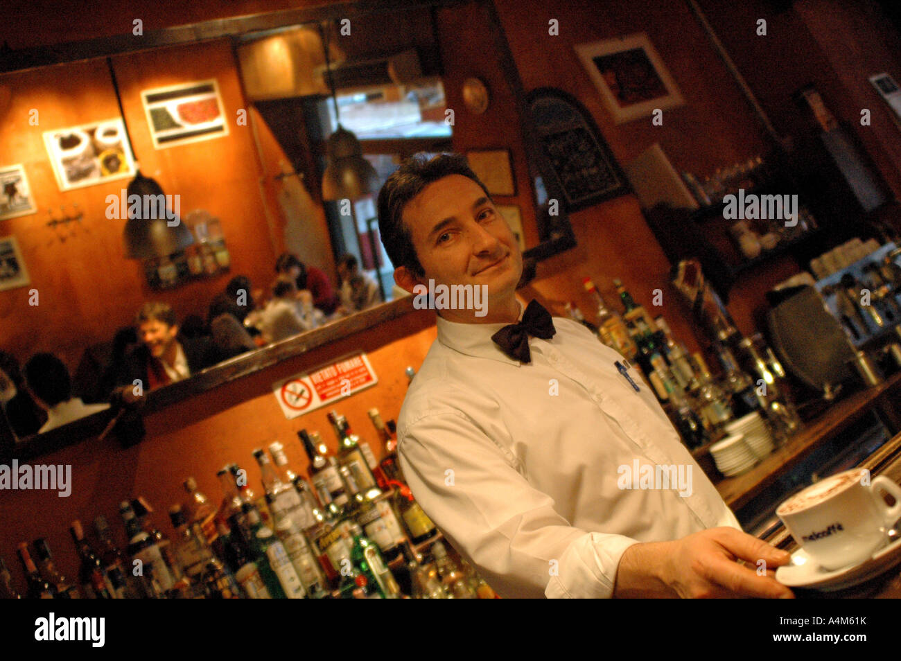 A barman in a cafe in the Navigli district Milan Italy Stock Photo - Alamy
