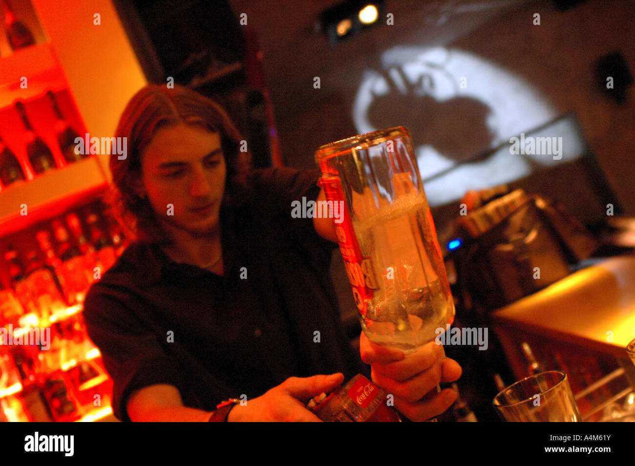 Barman preparing cocktails in a club in the Navigli area in Milan Italy ...
