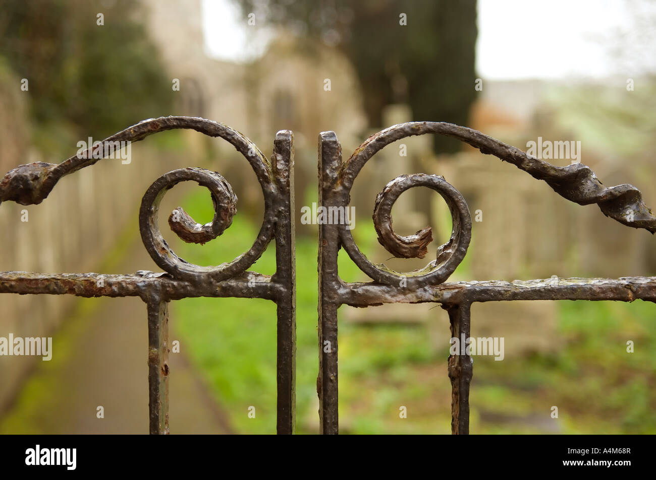 Ancient rusted gates leading into a UK churchyard Stock Photo - Alamy