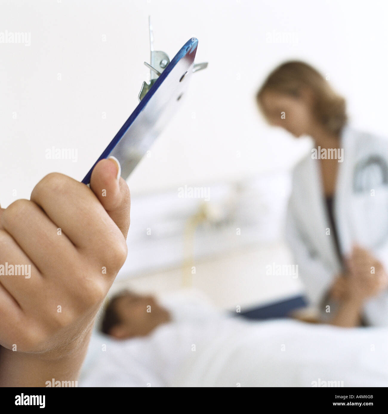Doctors visiting patient Stock Photo - Alamy