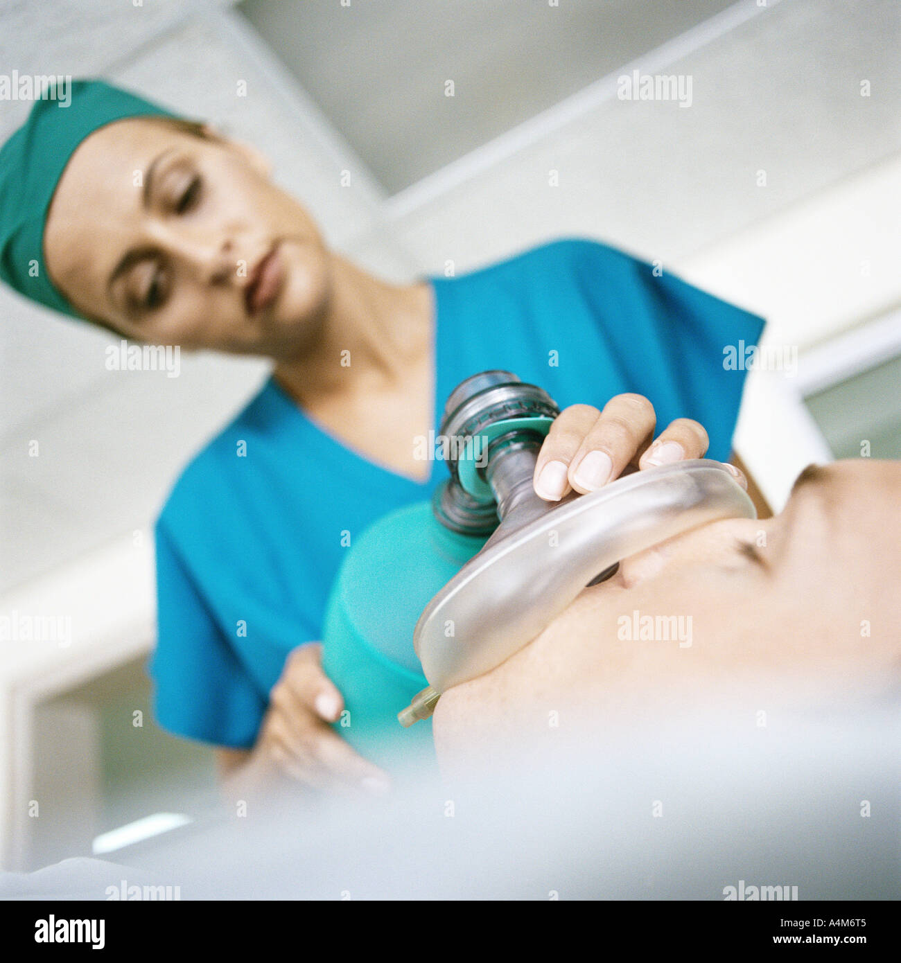 Female surgeon resuscitating unconscious hi-res stock photography and ...