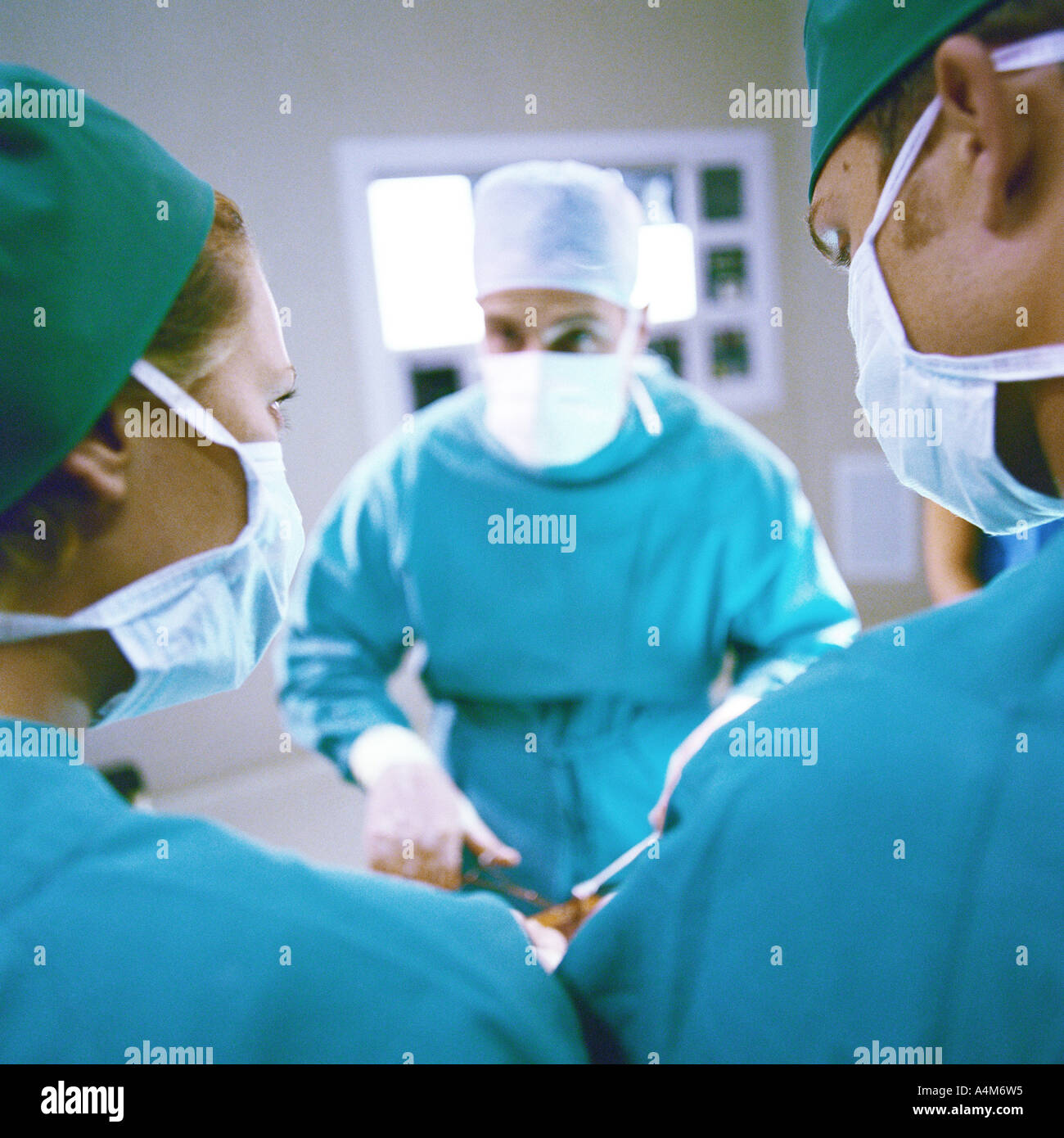 Doctors performing operation Stock Photo - Alamy