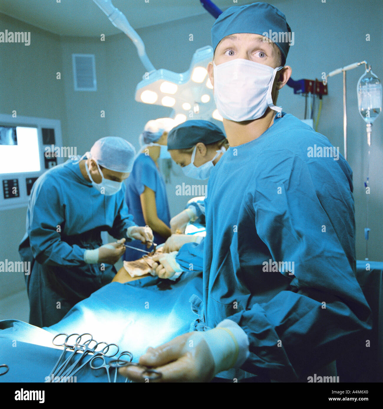Doctors performing operation Stock Photo - Alamy