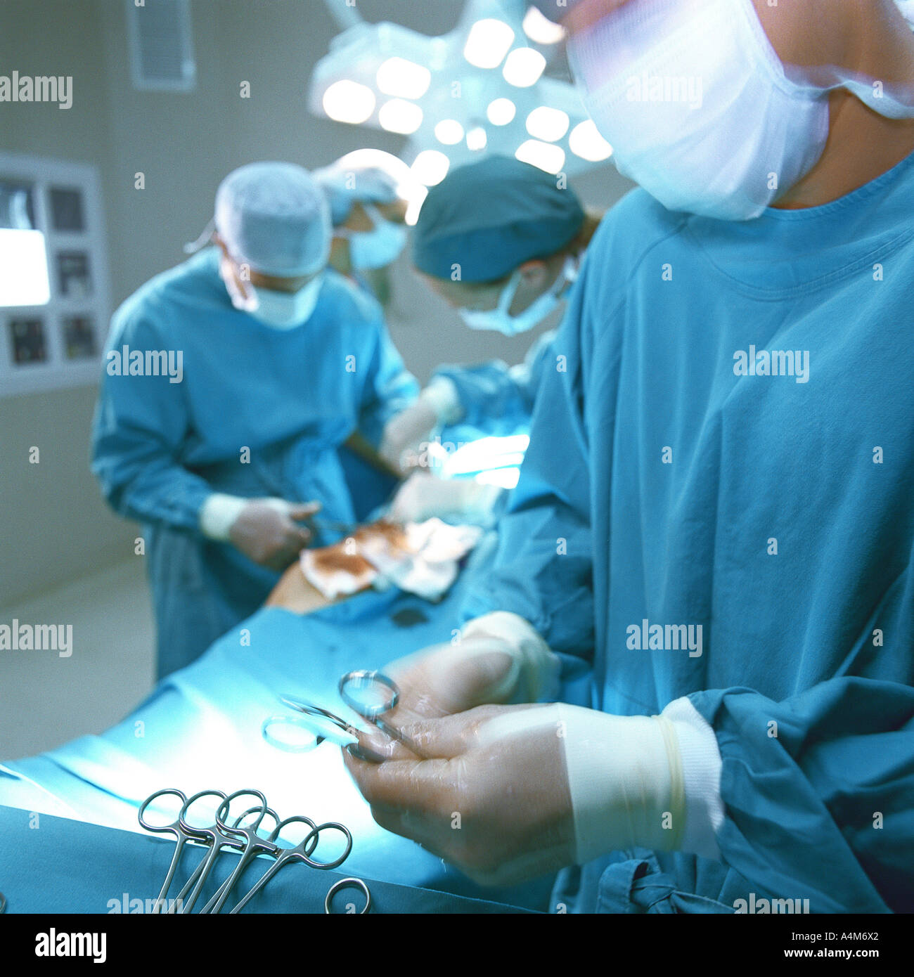 Doctors performing operation Stock Photo - Alamy