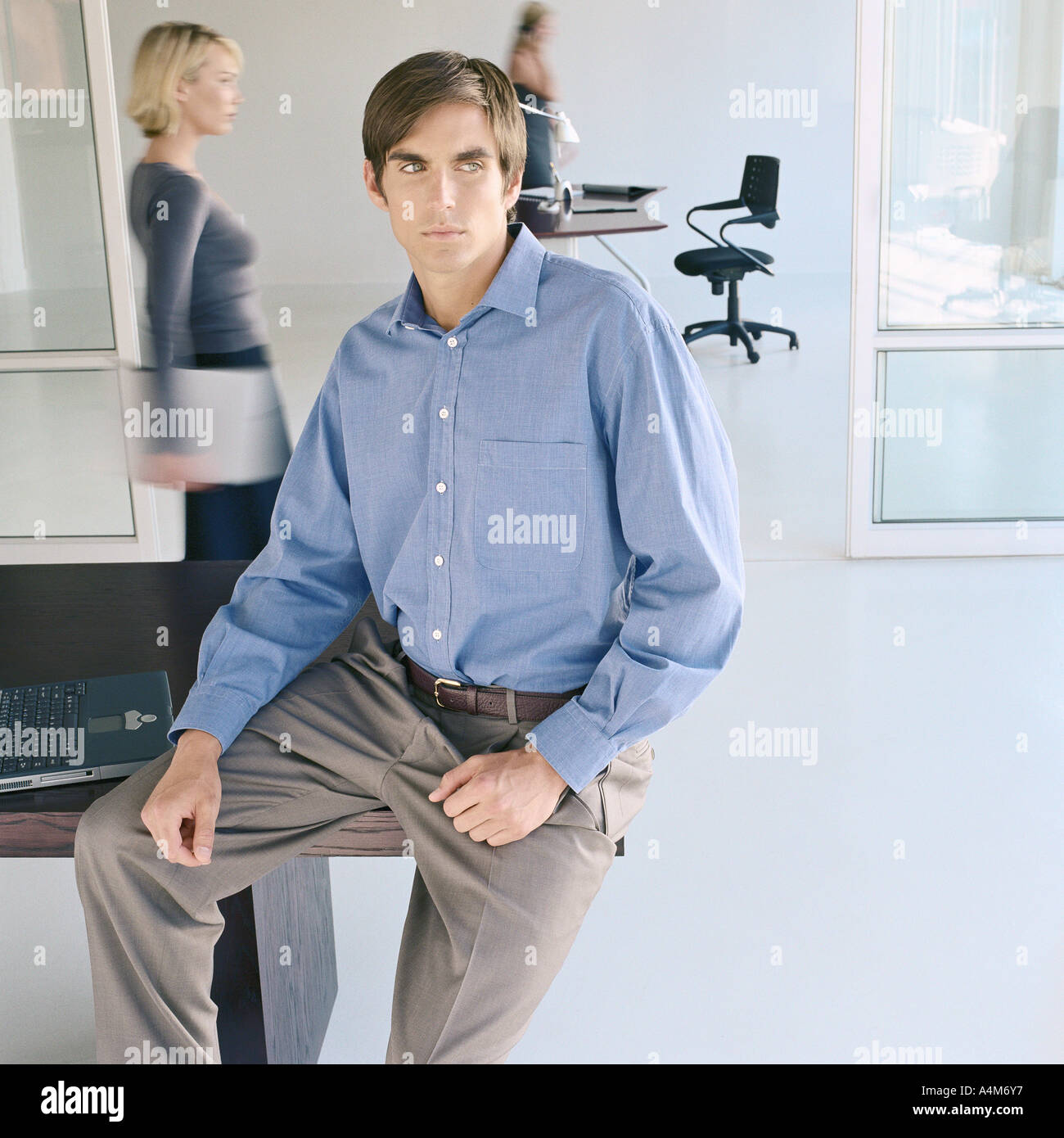 Secretary sitting on edge of desk hi-res stock photography and images ...