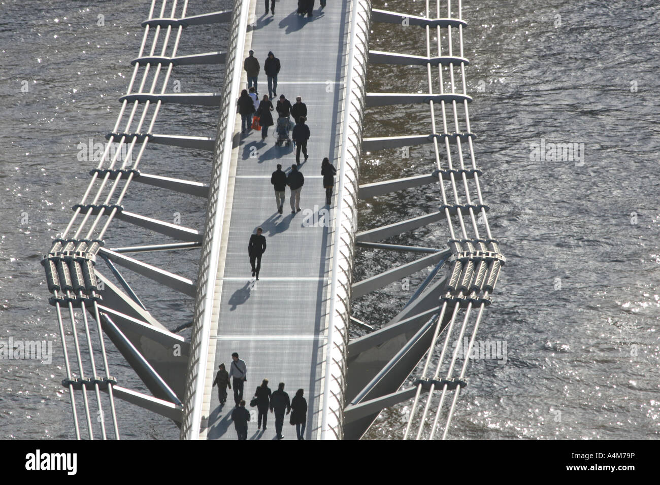 People cross the millennium bridge Stock Photo - Alamy