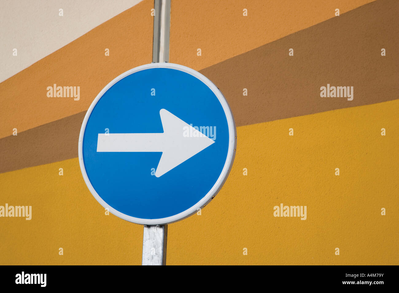 Traffic sign with arrow ordering direction of traffic Stock Photo - Alamy