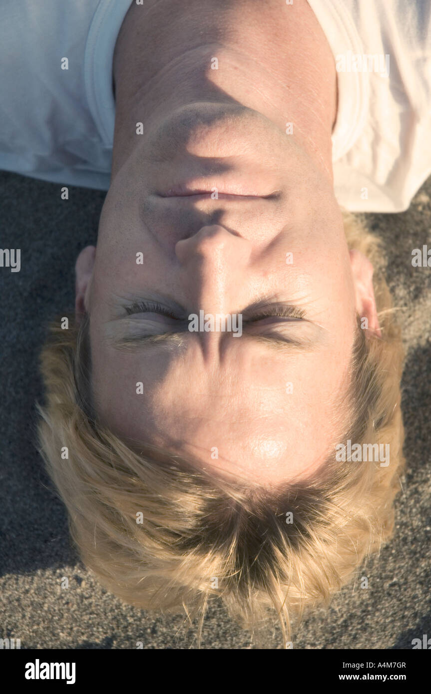 Man s head upside down with eyes closed Stock Photo - Alamy