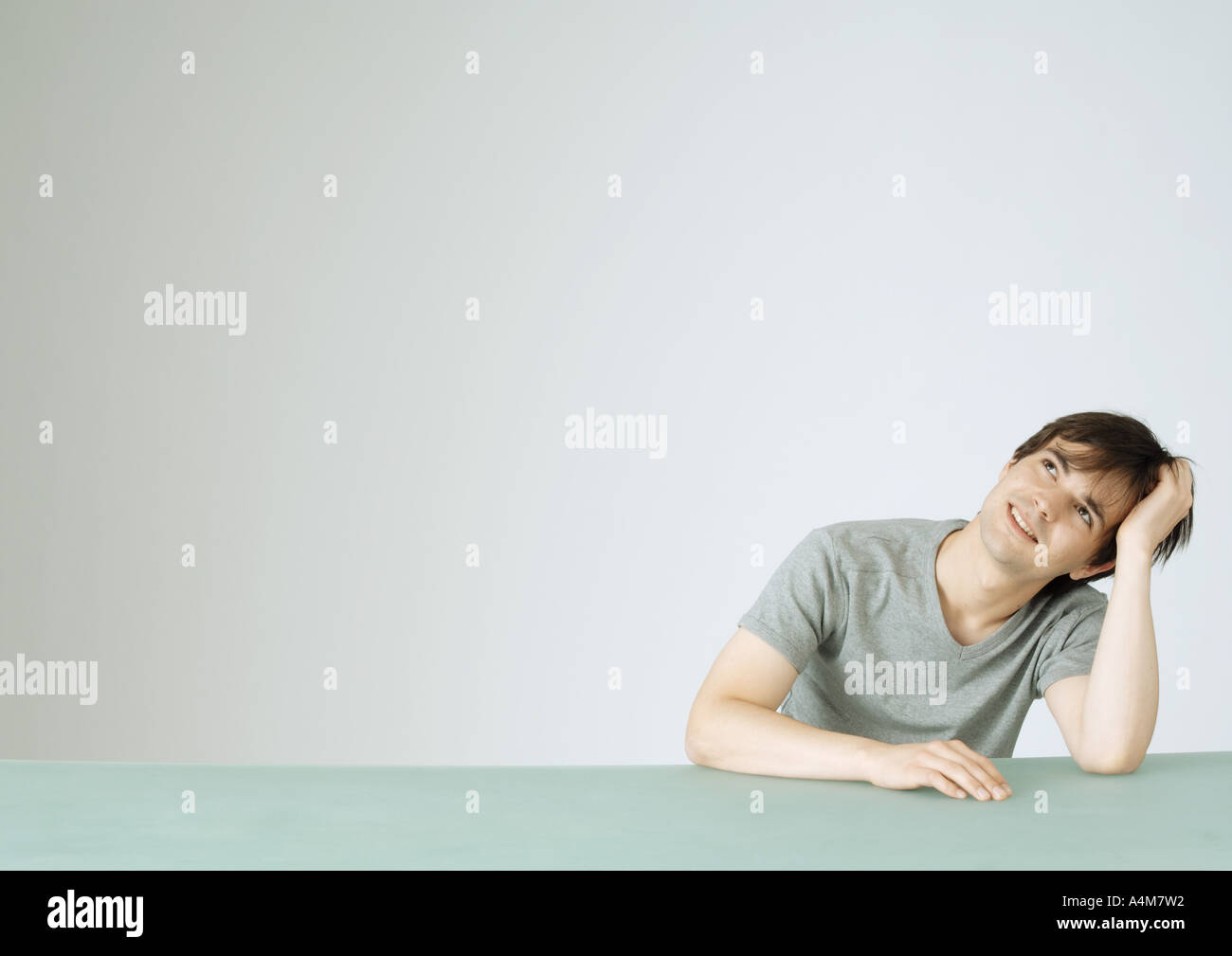 Young man looking up, portrait Stock Photo - Alamy