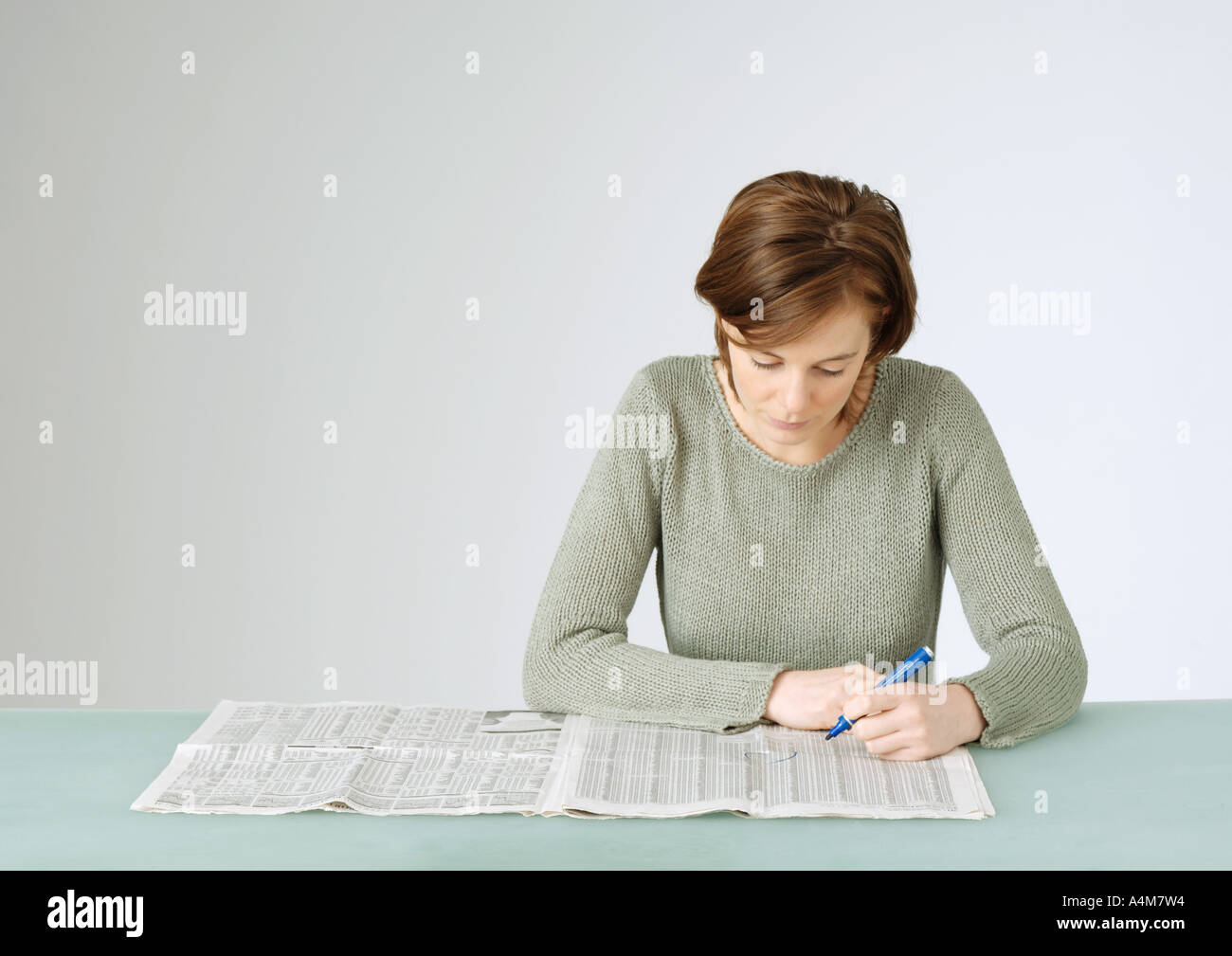 Person holding reading open newspaper hi-res stock photography and ...