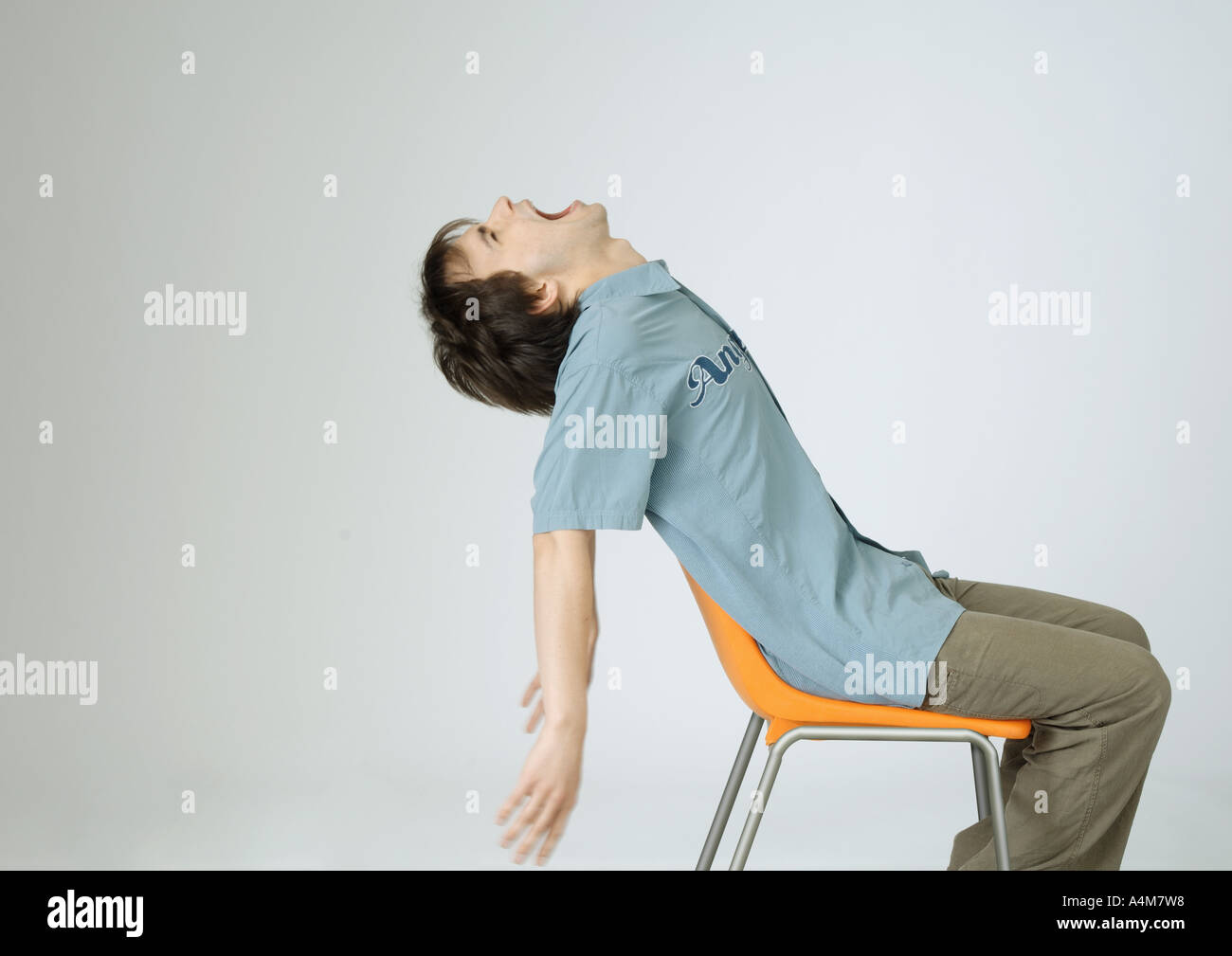 Man sitting in chair screaming hi-res stock photography and images - Alamy