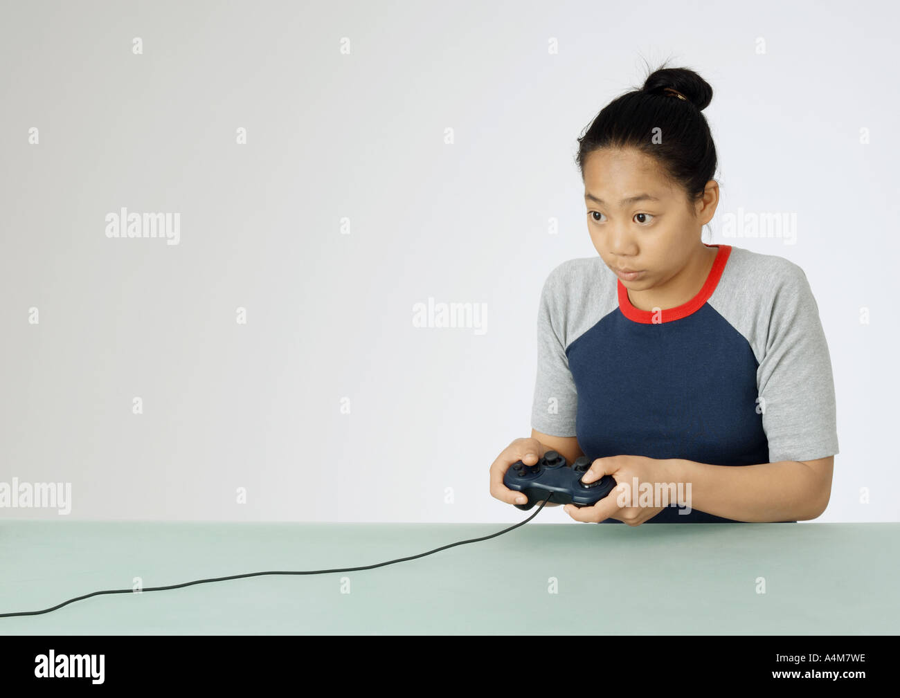 Young woman playing video game Stock Photo - Alamy