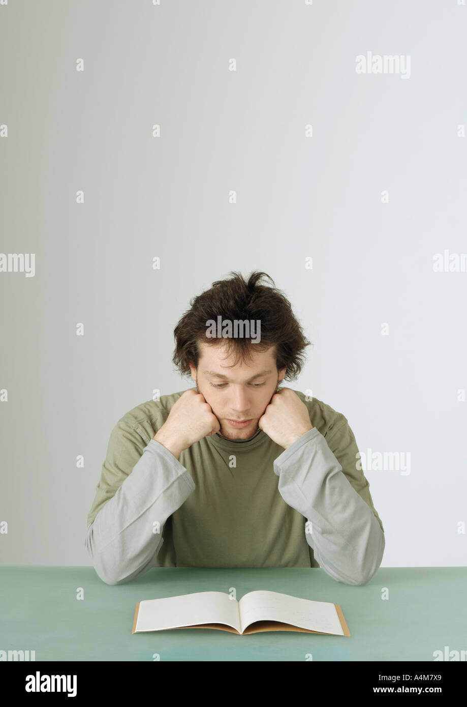 Man writing notebook table front view hi-res stock photography and ...