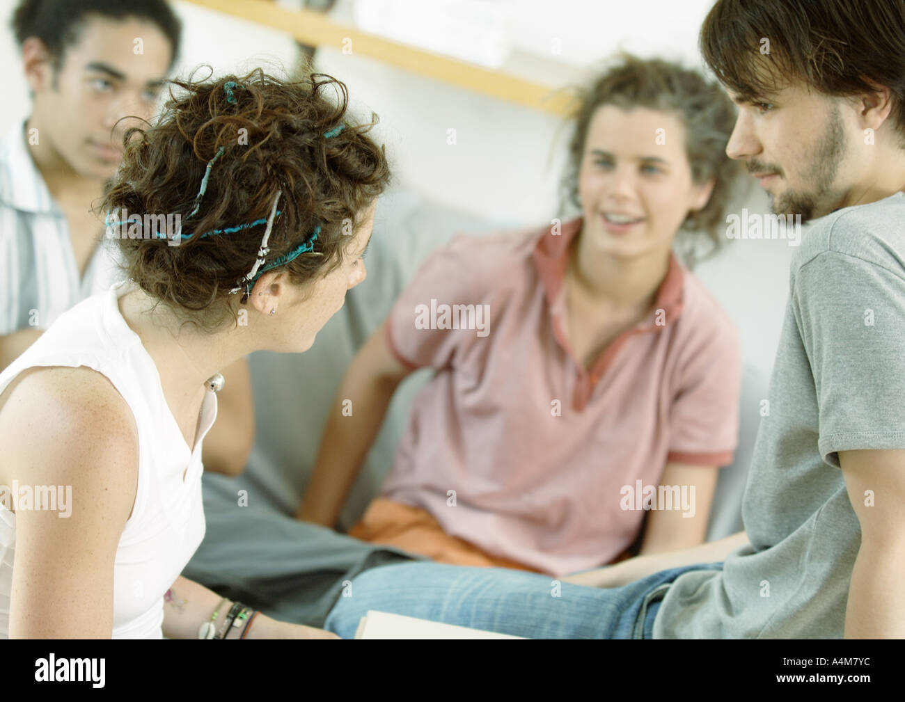 Young people talking Stock Photo - Alamy